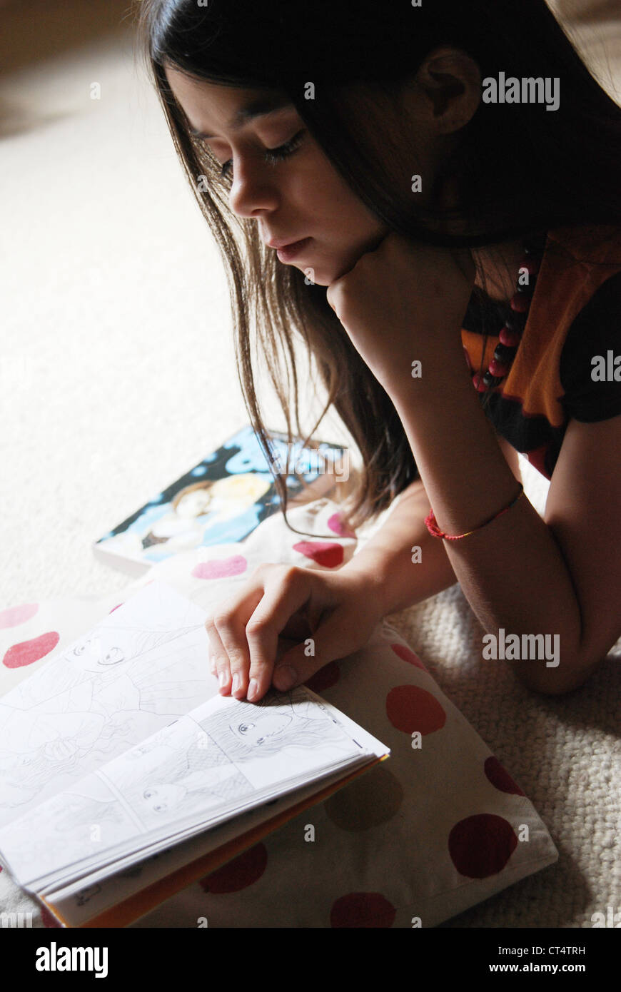 Teenage girl reading comic hi-res stock photography and images - Alamy