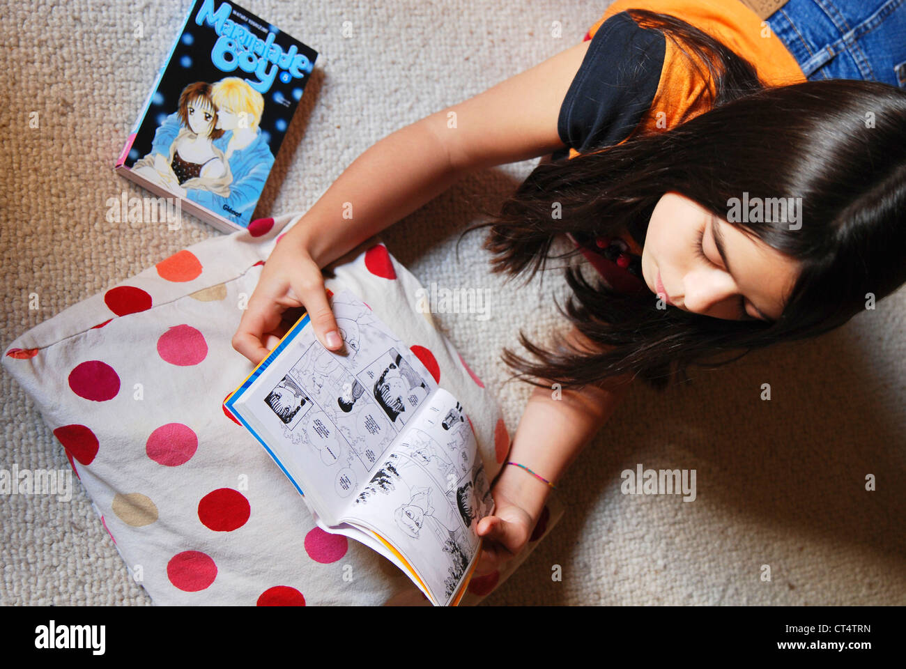 Teenage girl reading comic hi-res stock photography and images - Alamy