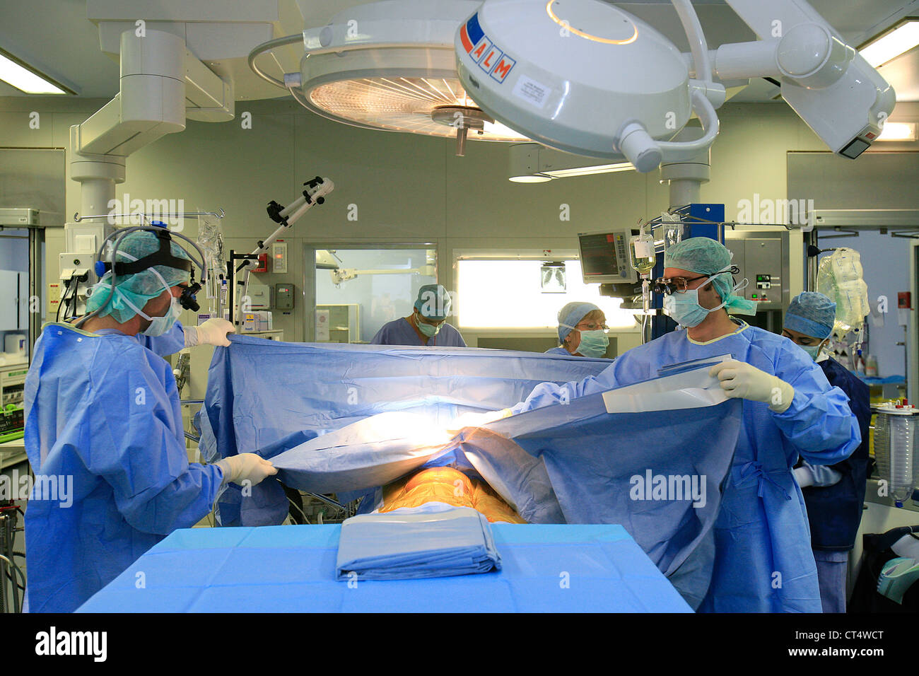 Hospital staff prepare patient surgery hi-res stock photography and ...