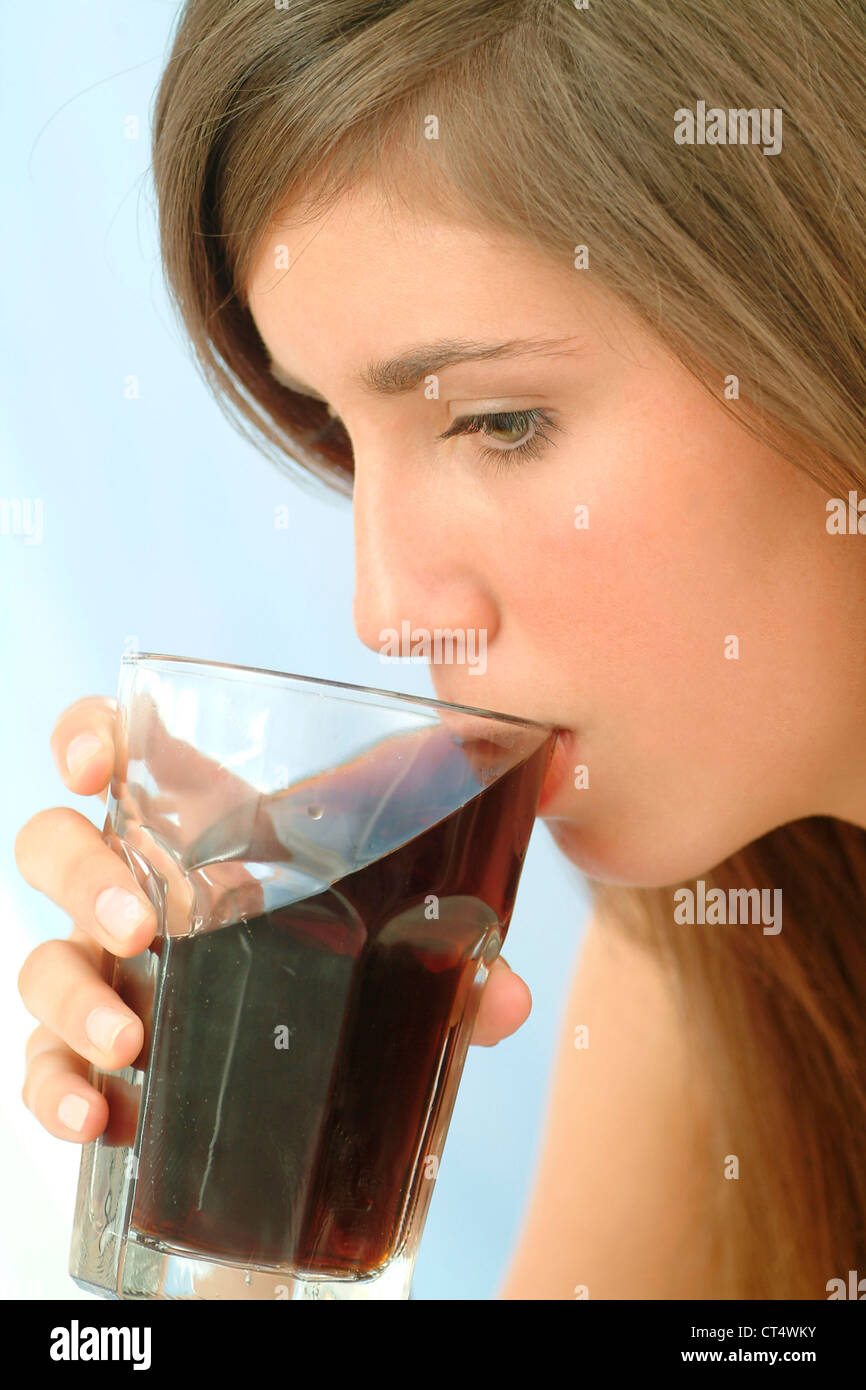 ADOLESCENT WITH COLD DRINK Stock Photo - Alamy