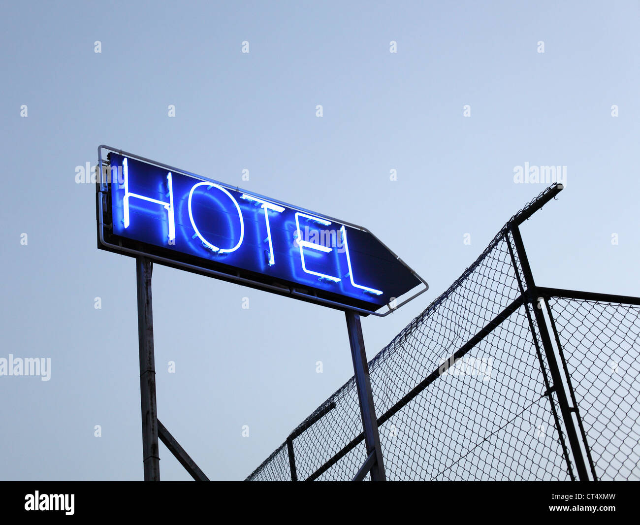 Hotel sign illuminated at dusk Stock Photo - Alamy