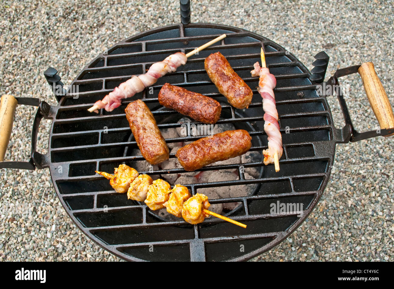 Croatian deli cevapi on barbecue Stock Photo - Alamy