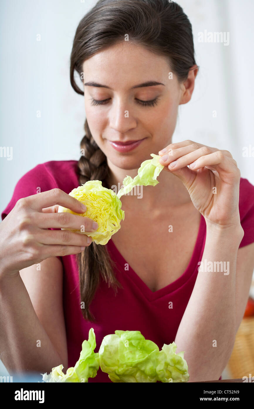 WOMAN EATING RAW VEGETABLES Stock Photo - Alamy