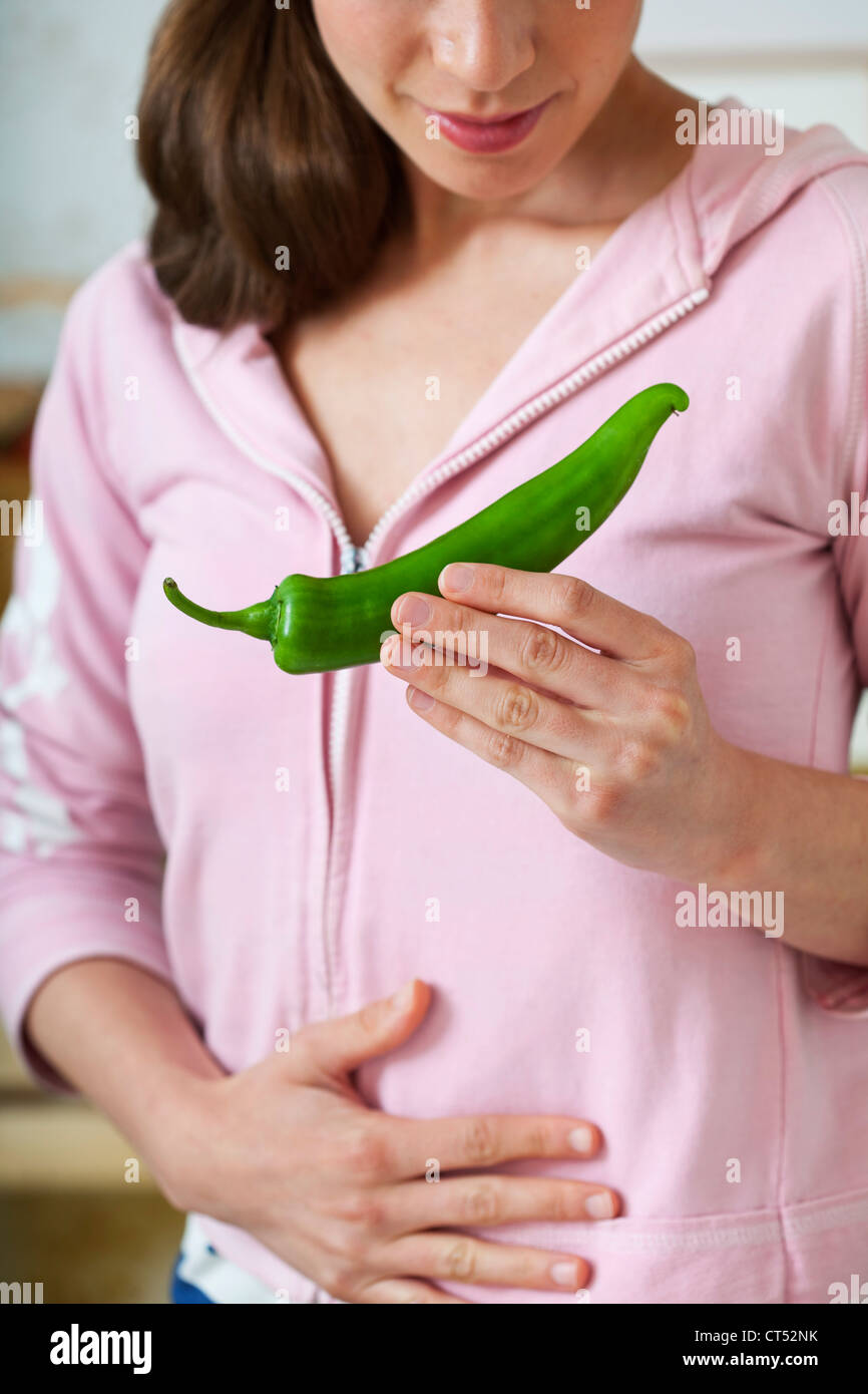 WOMAN EATING SPICE Stock Photo - Alamy