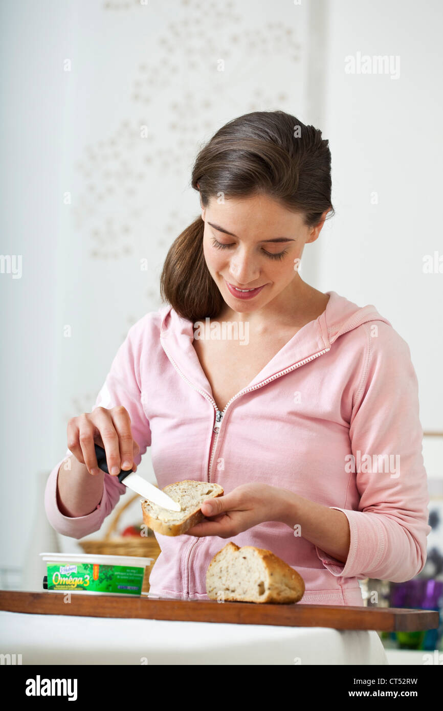 WOMAN EATING BREAKFAST Stock Photo - Alamy