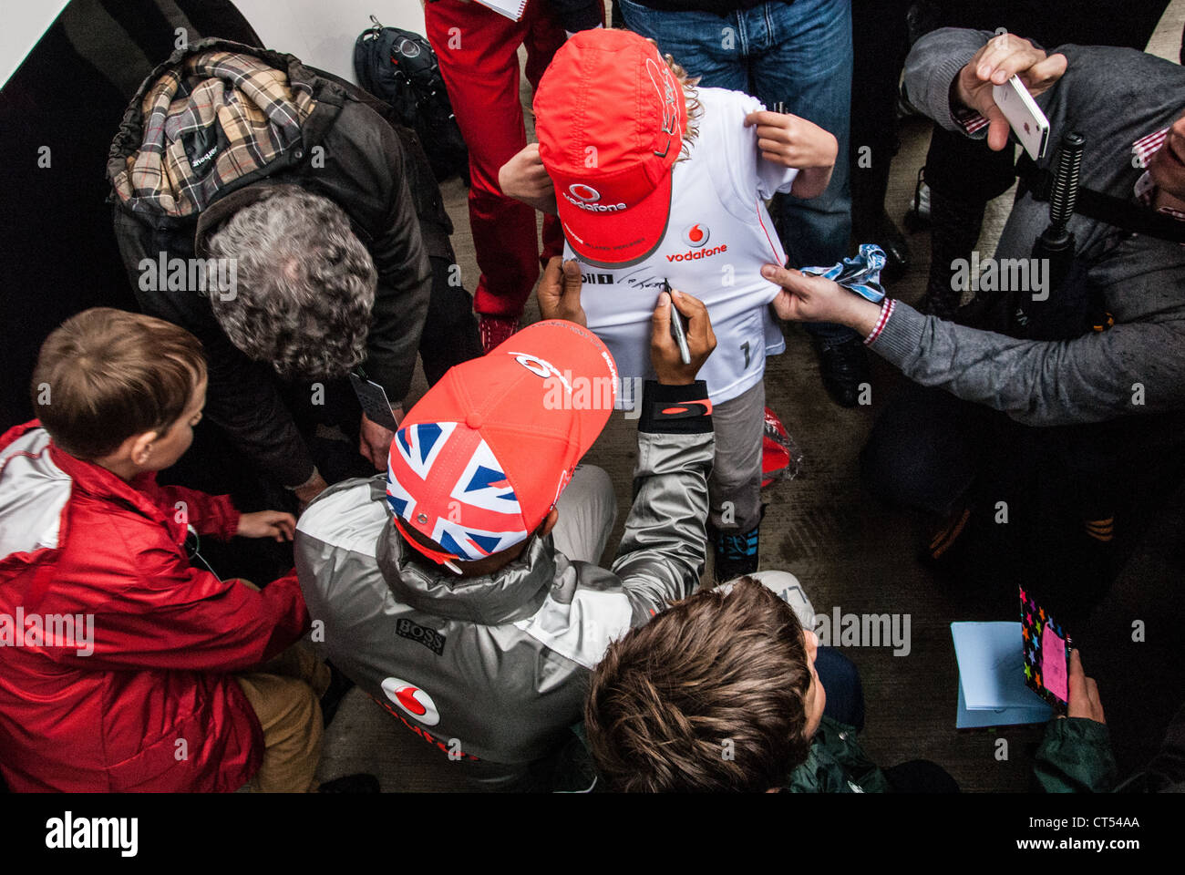 Lewis Hamilton signing autographs. British Formula 1 Grand Prix ...