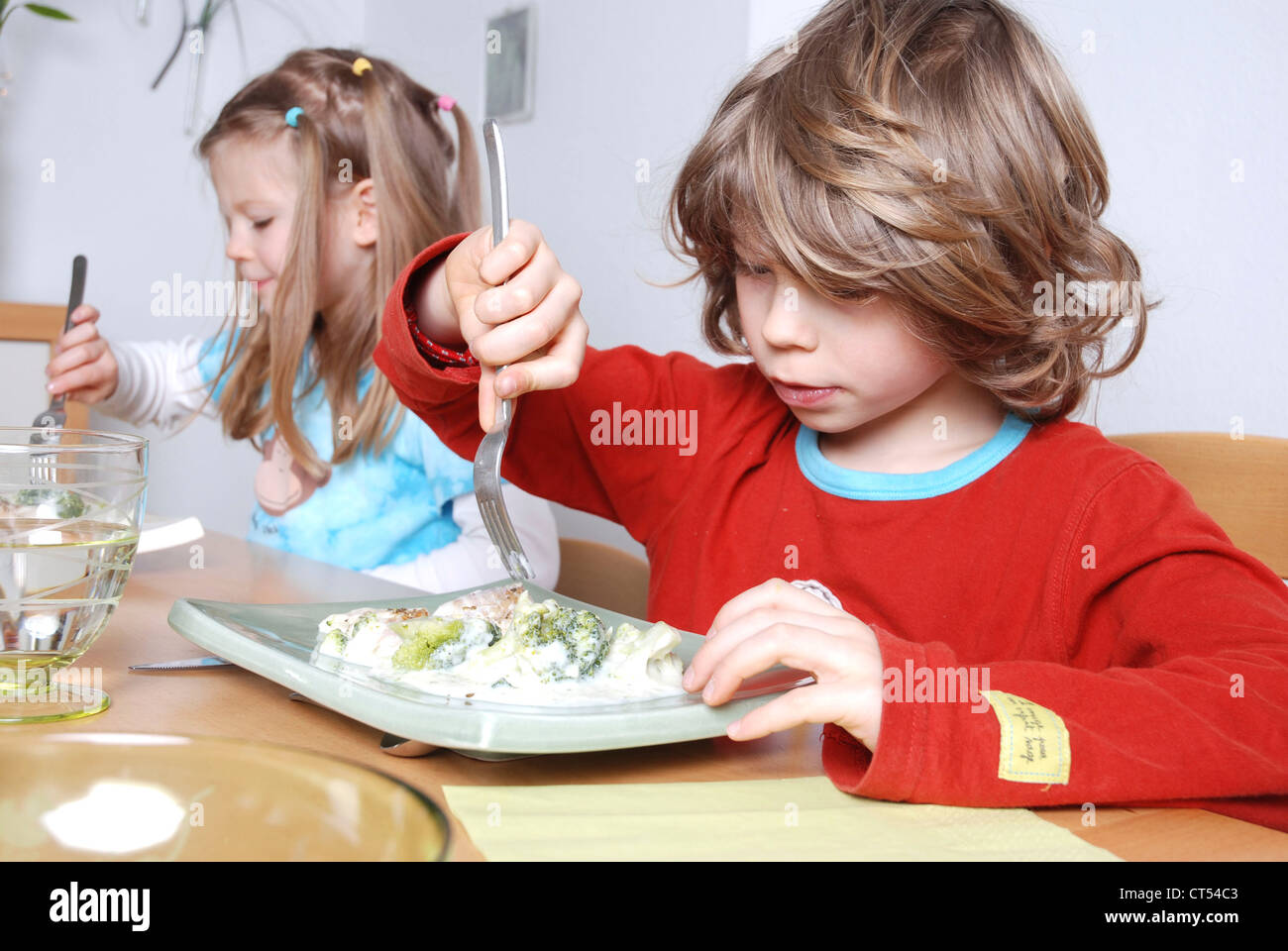 CHILD EATING A MEAL Stock Photo - Alamy