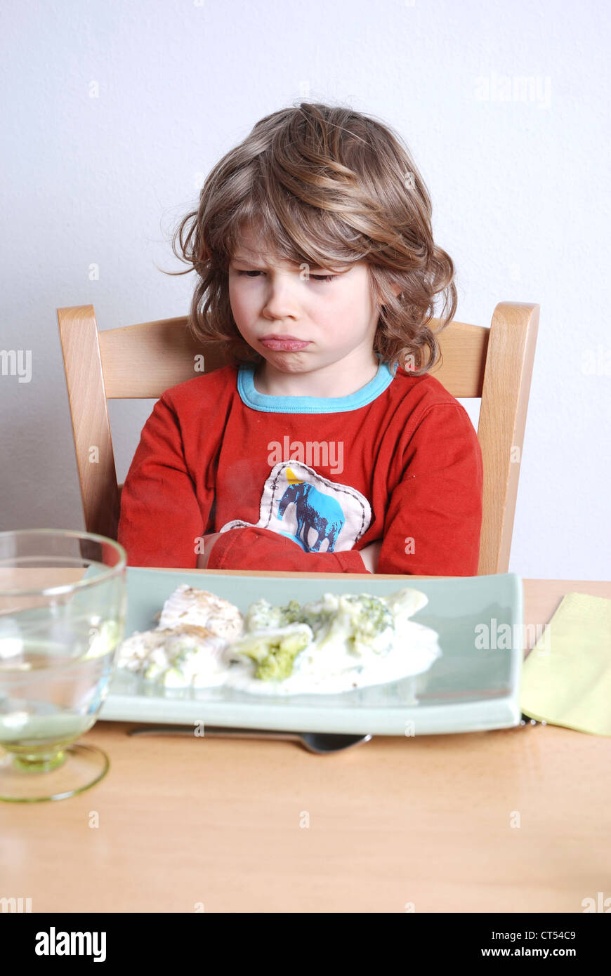 CHILD EATING A MEAL Stock Photo - Alamy