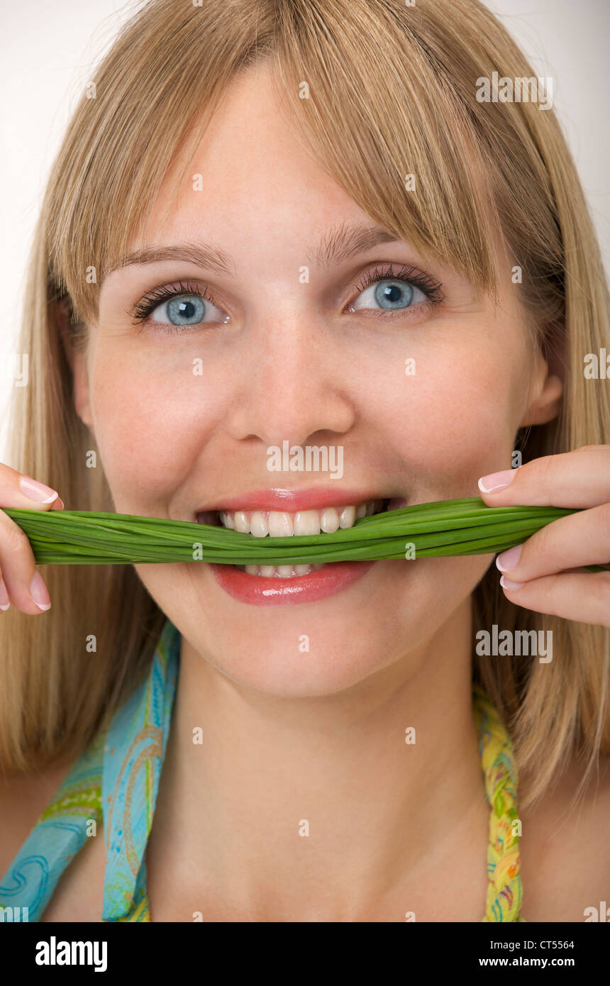 WOMAN EATING SPICE Stock Photo - Alamy
