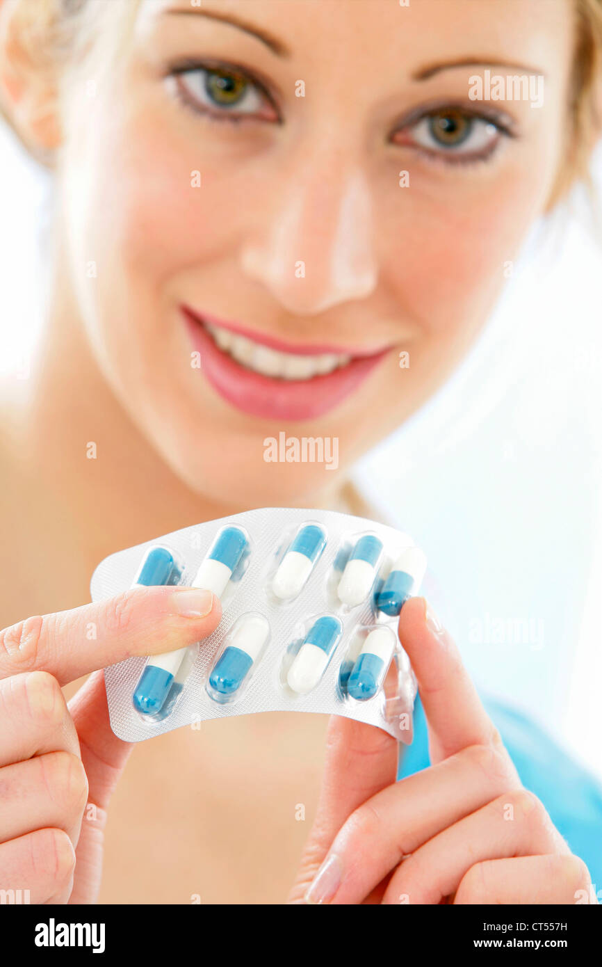 WOMAN TAKING MEDICATION Stock Photo - Alamy