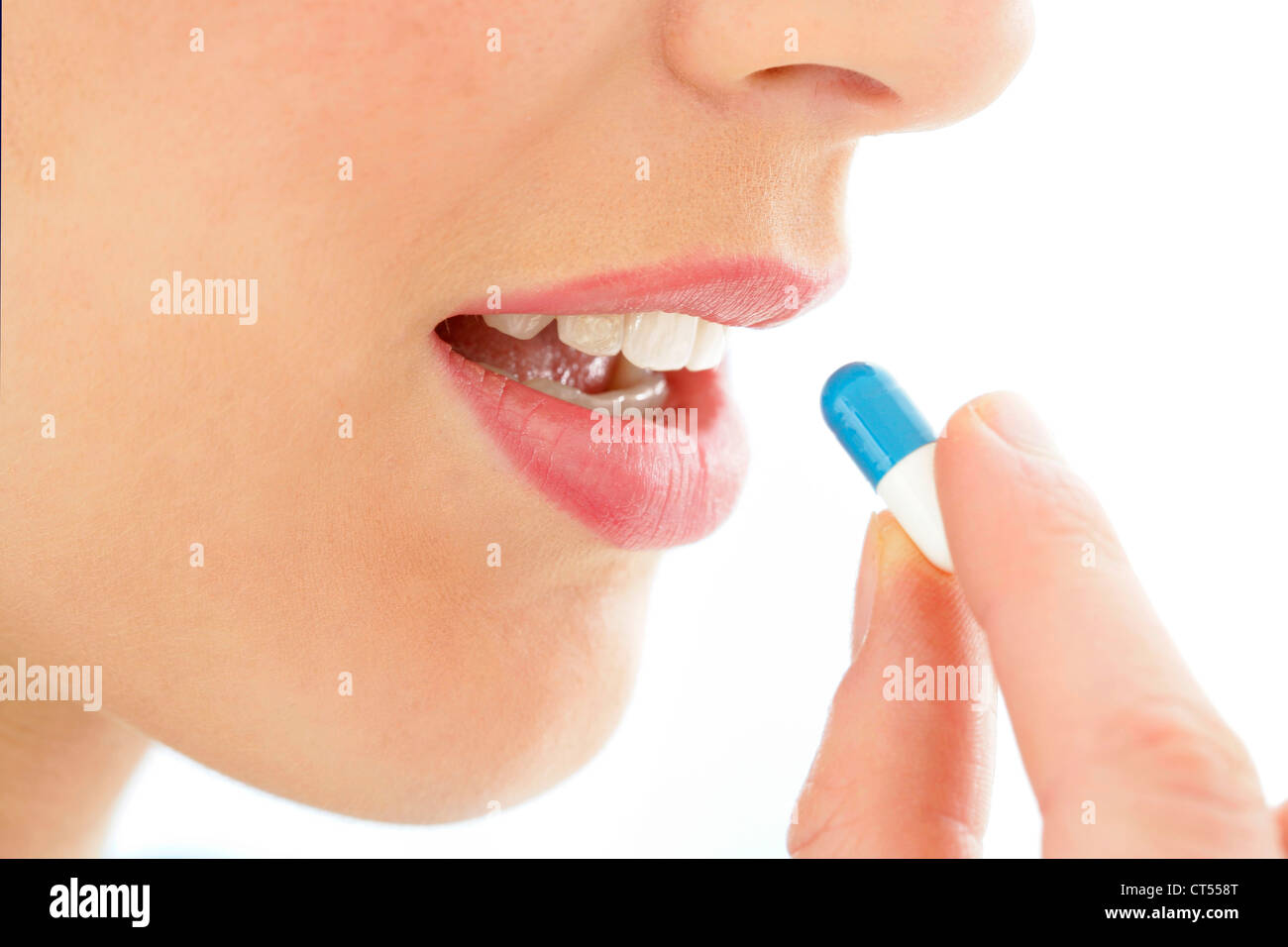 WOMAN TAKING MEDICATION Stock Photo - Alamy