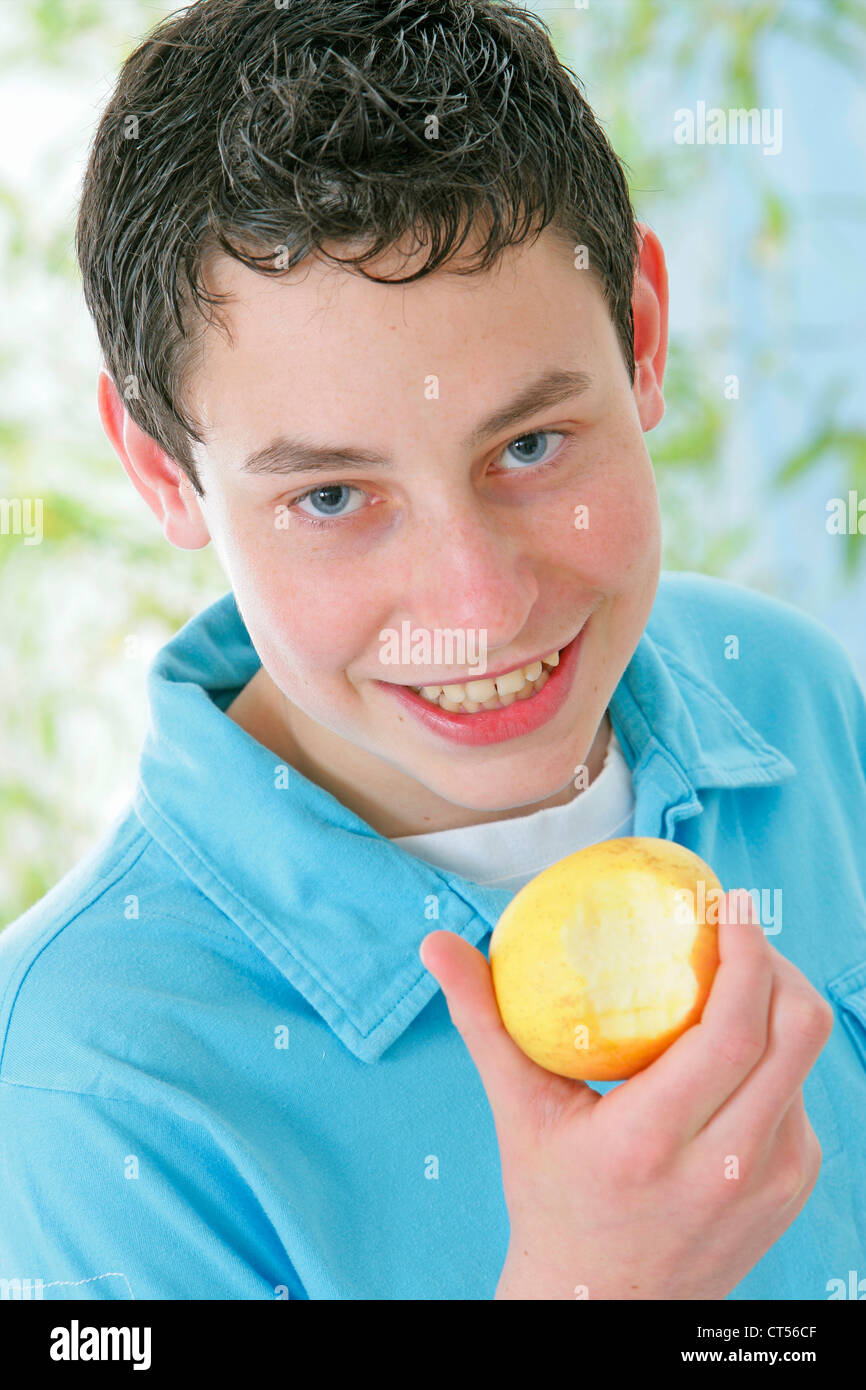 ADOLESCENT EATING FRUIT Stock Photo - Alamy