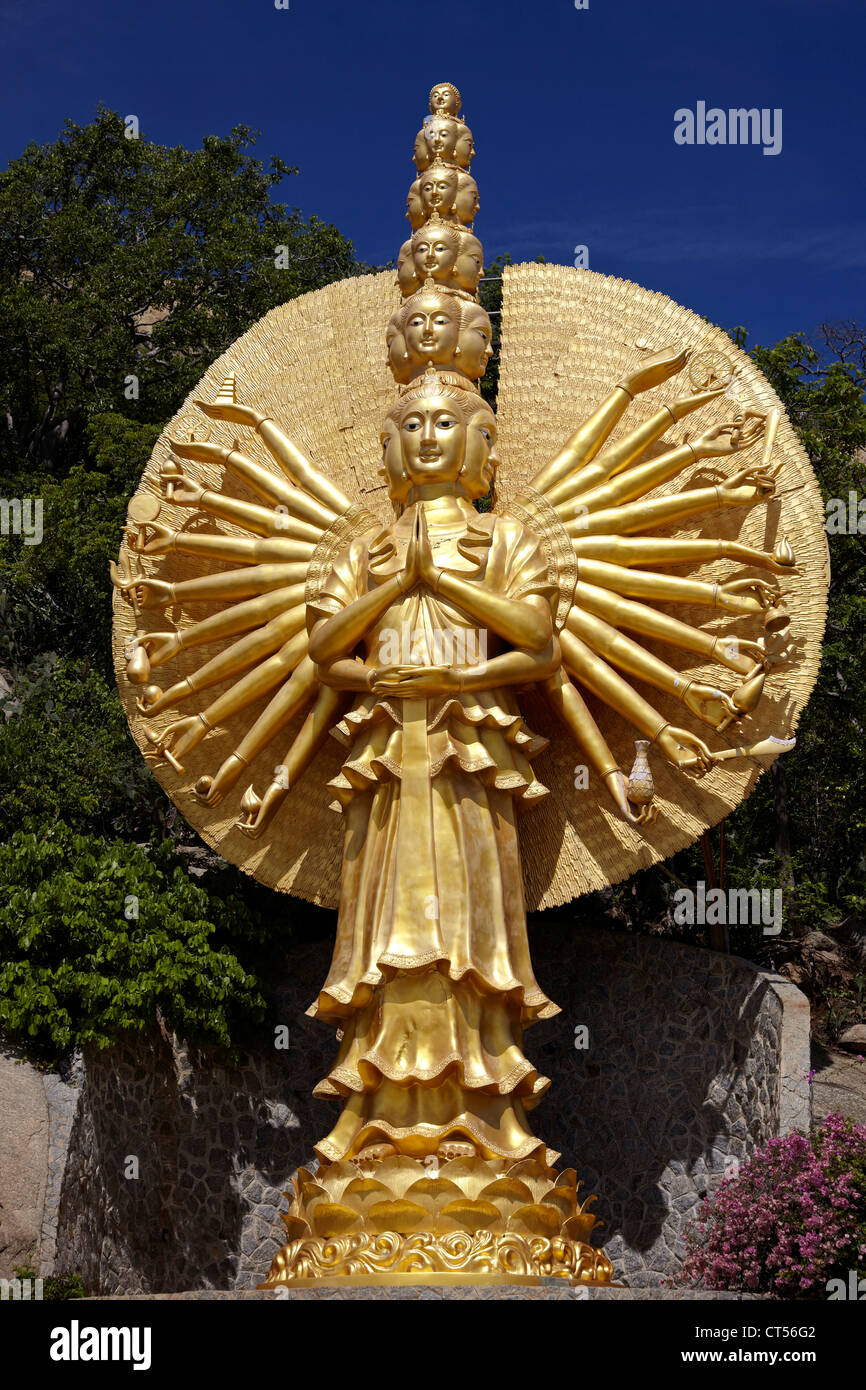 Ornate golden multi faced female deity figure with many arms at Khao ...