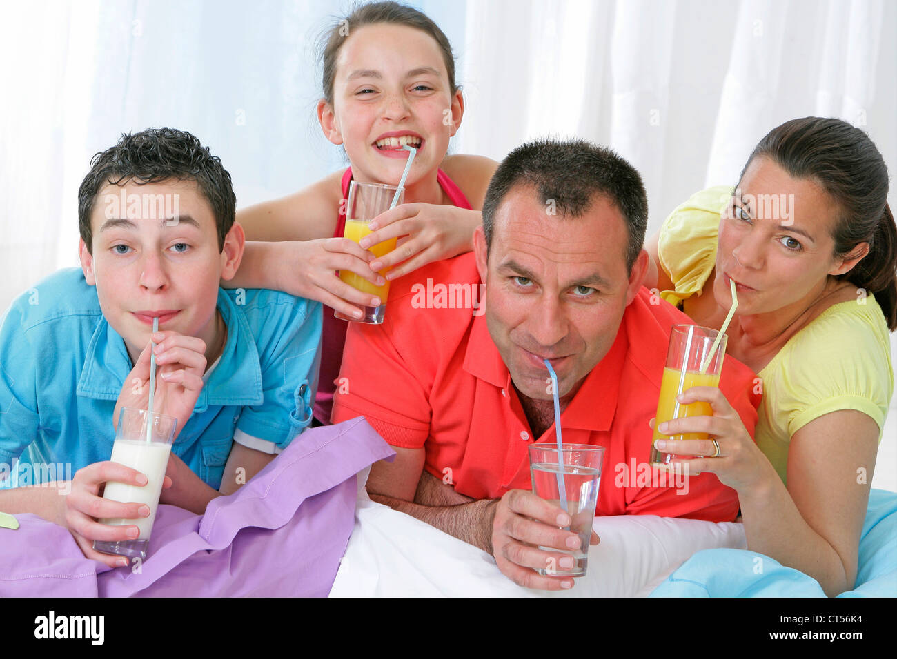 FAMILY WITH COLD DRINK Stock Photo - Alamy