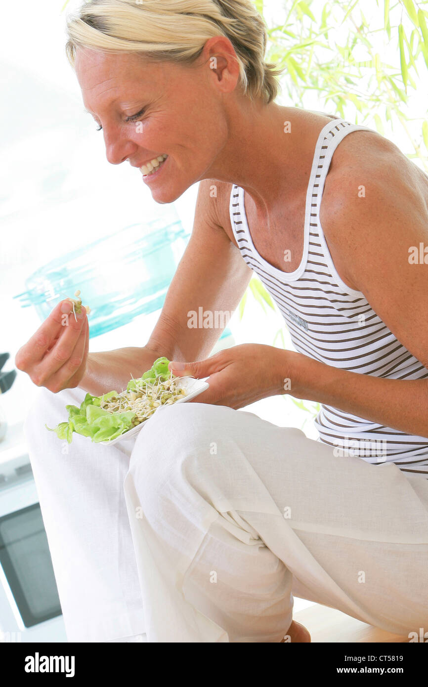 ELDERLY P. EATING RAW VEGETABLES Stock Photo - Alamy