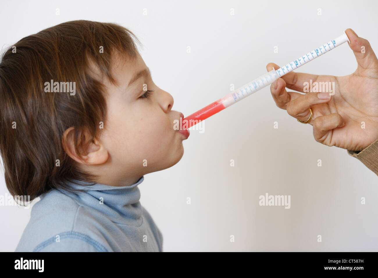 CHILD TAKING MEDICATION Stock Photo - Alamy