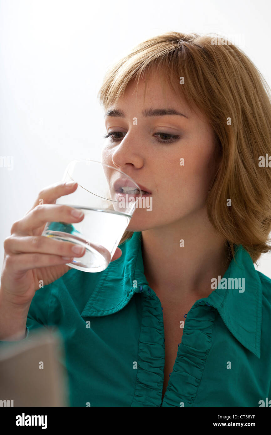 WOMAN WITH COLD DRINK Stock Photo - Alamy