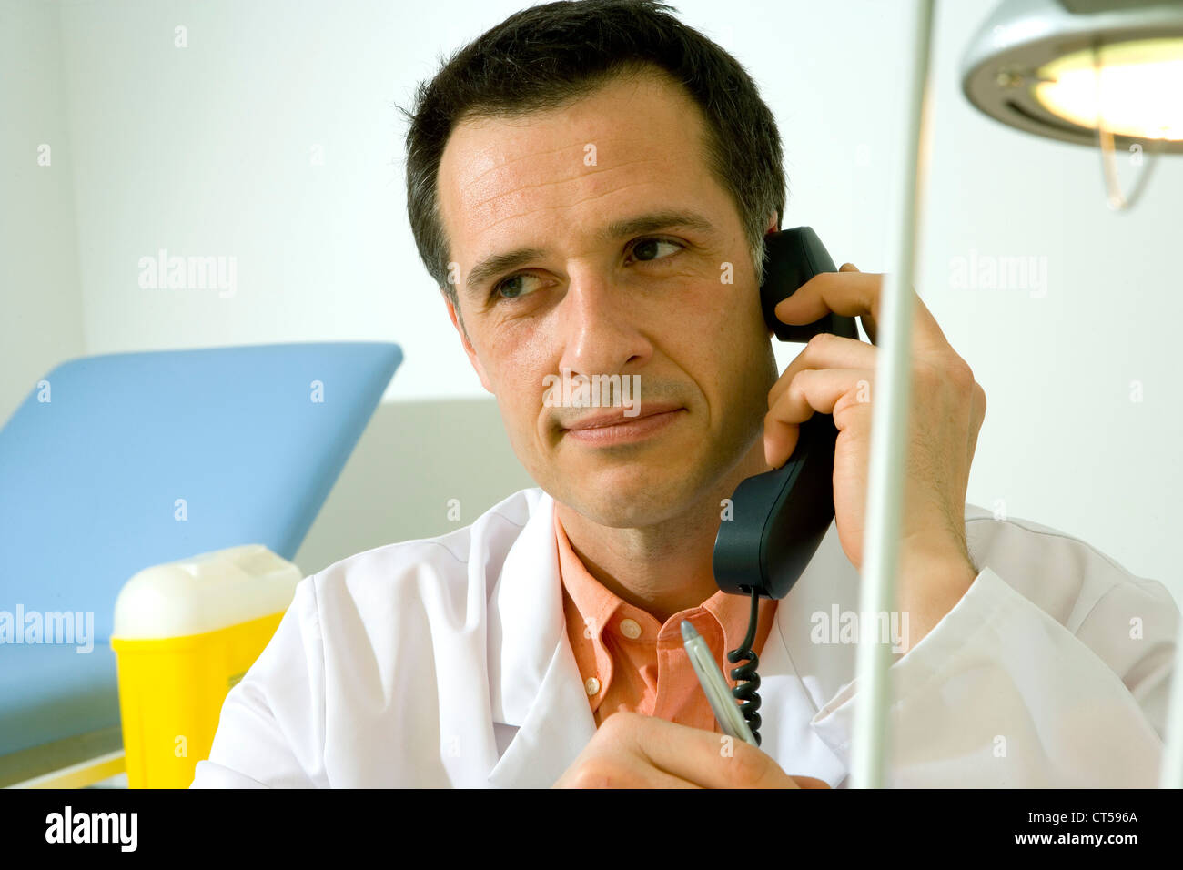 Doctor on telephone hi-res stock photography and images - Alamy