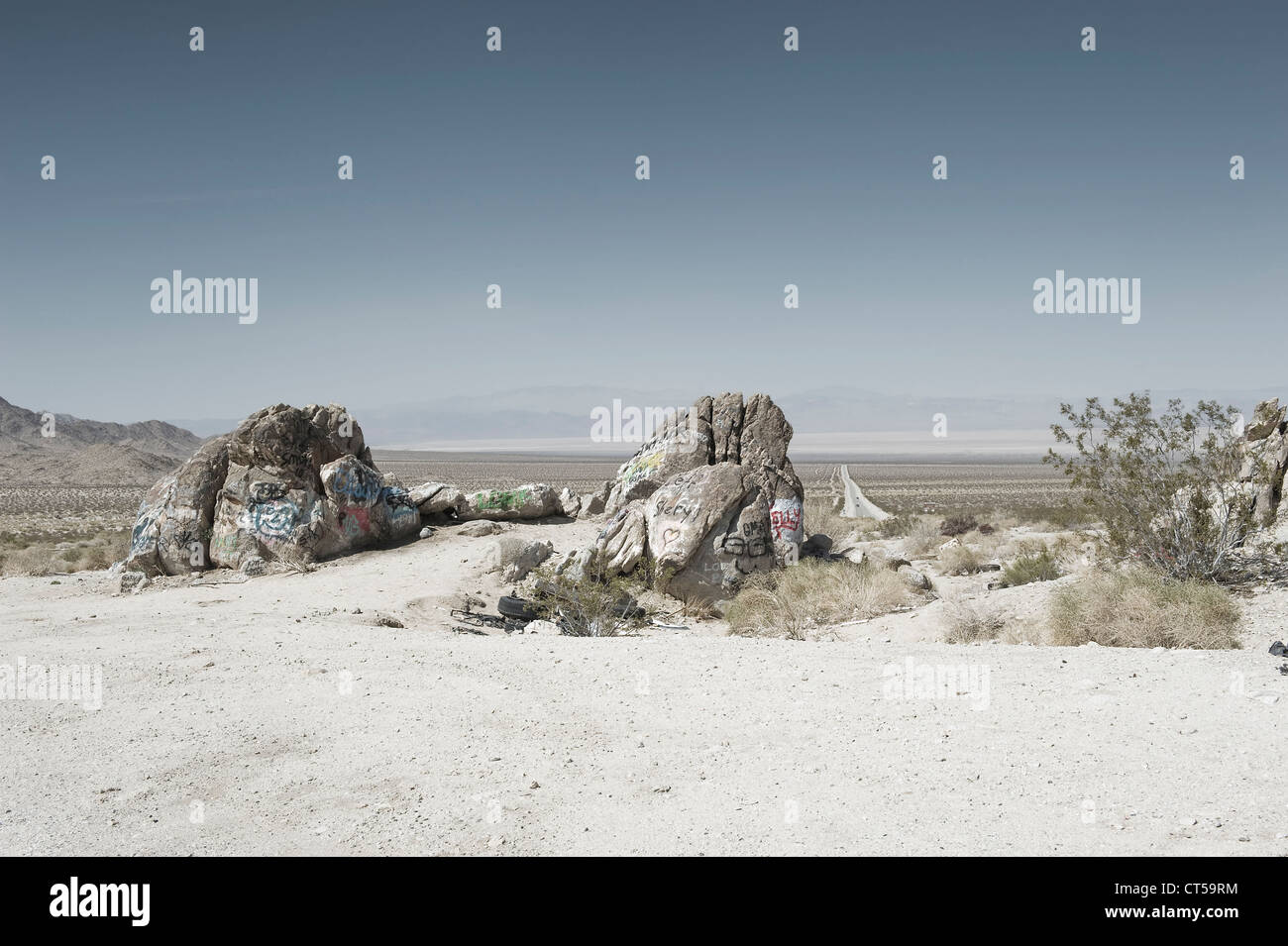 Graffiti covered rocks in the Mojave Desert, California,USA. Long ...