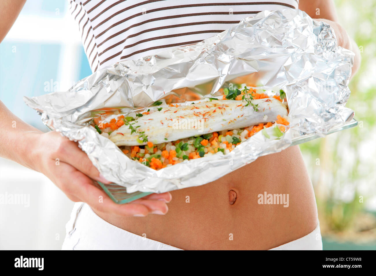 WOMAN EATING FISH Stock Photo - Alamy