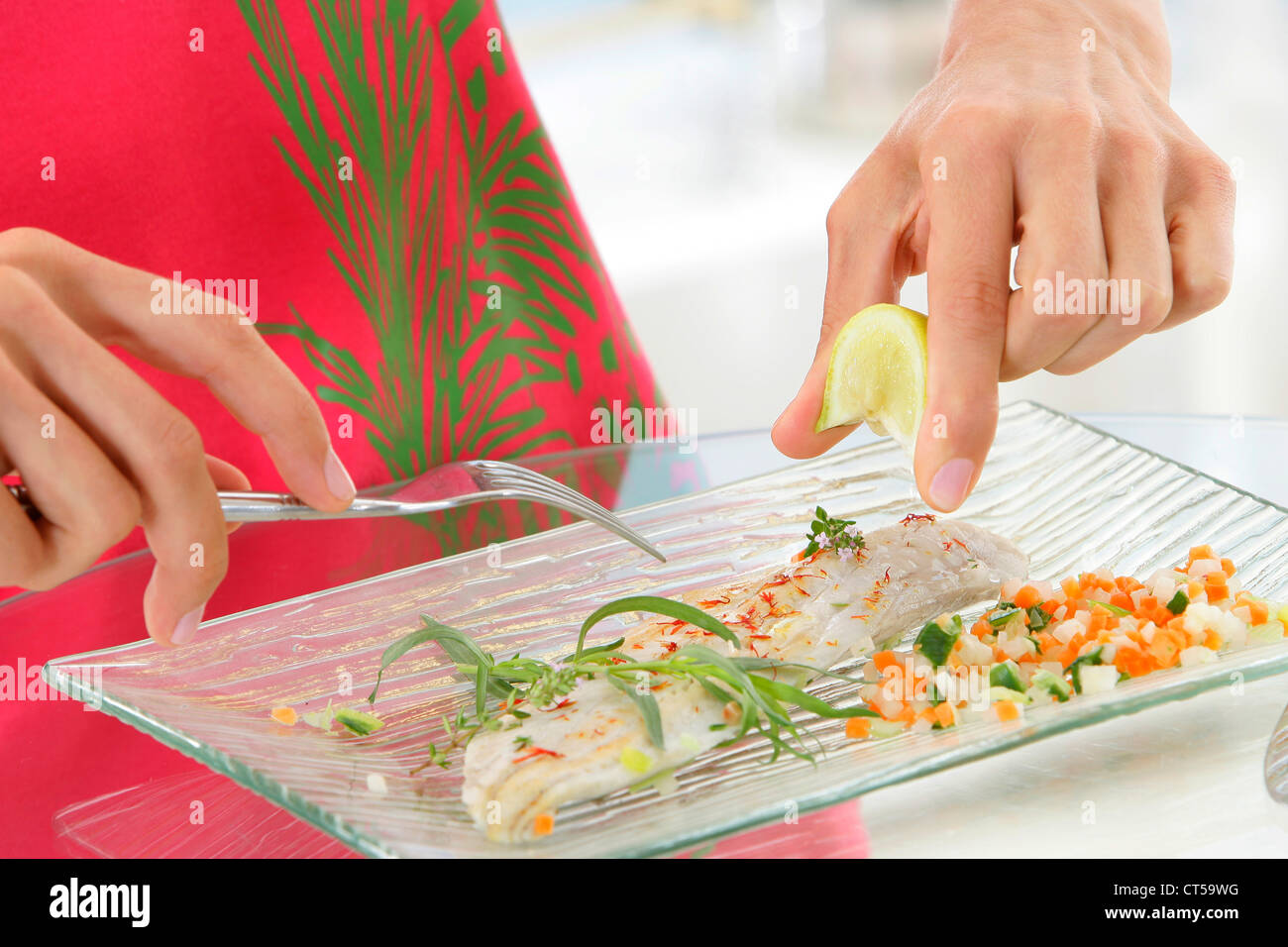 WOMAN EATING FISH Stock Photo - Alamy
