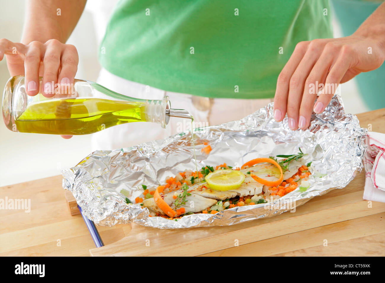 WOMAN EATING FISH Stock Photo - Alamy