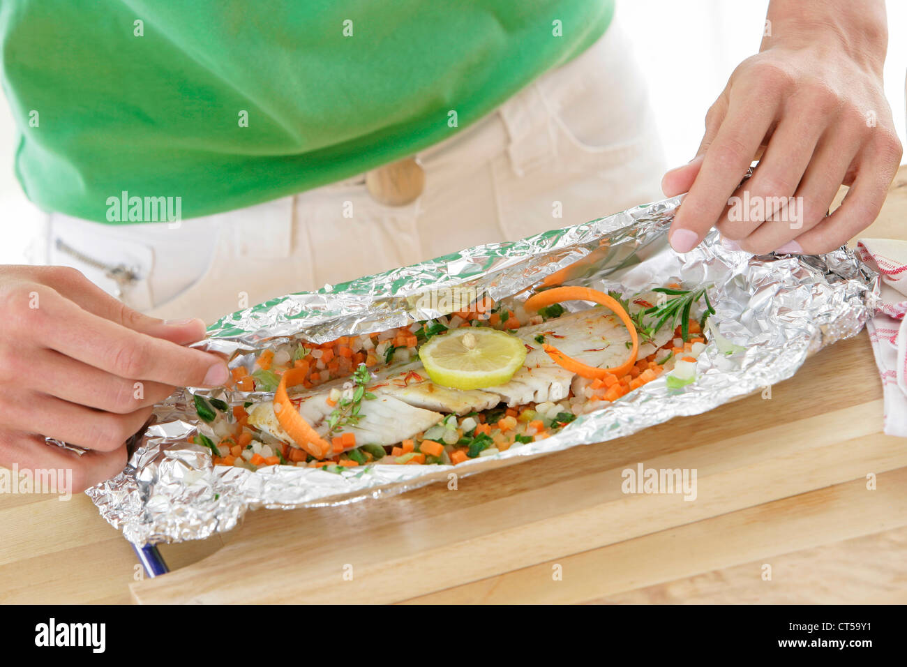 WOMAN EATING FISH Stock Photo - Alamy