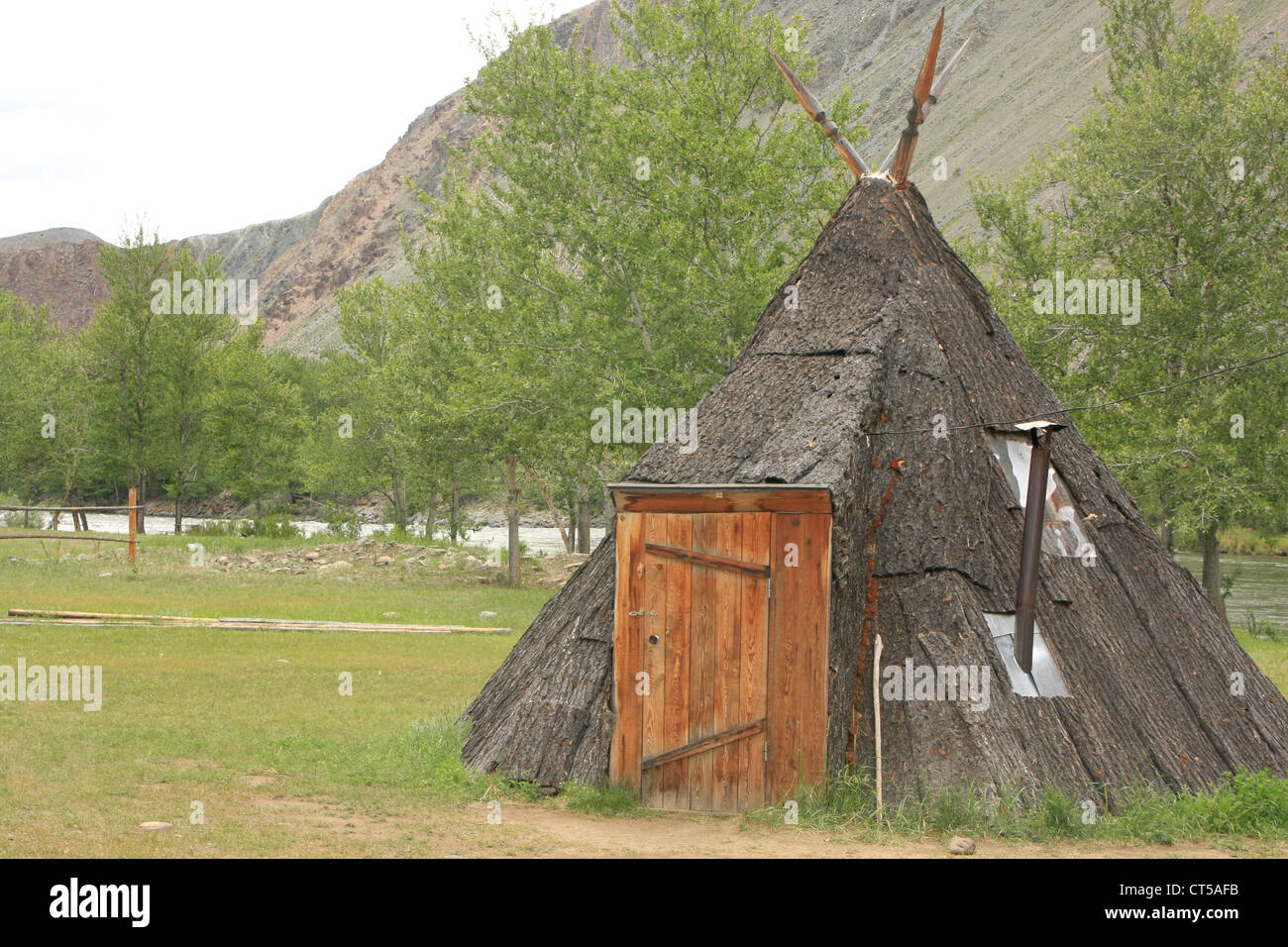 Traditional wooden teepee at riverside, River Chulyshman Valley, Altai ...