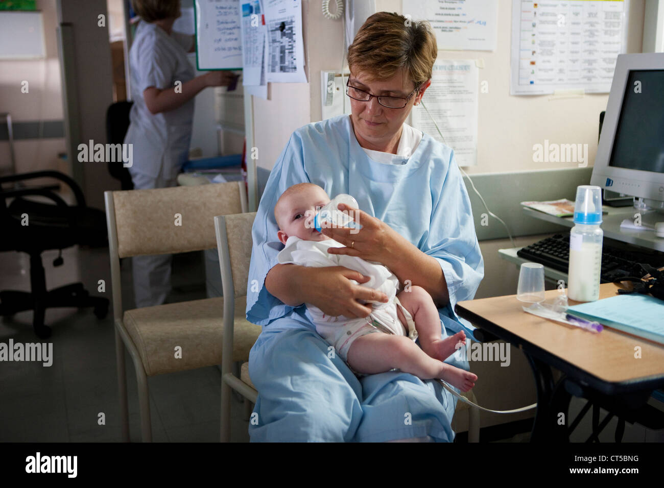 Infant Drinking From Baby Bottle Stock Photo Alamy