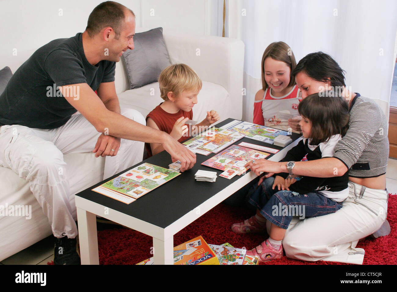 FAMILY PLAYING INDOORS Stock Photo - Alamy