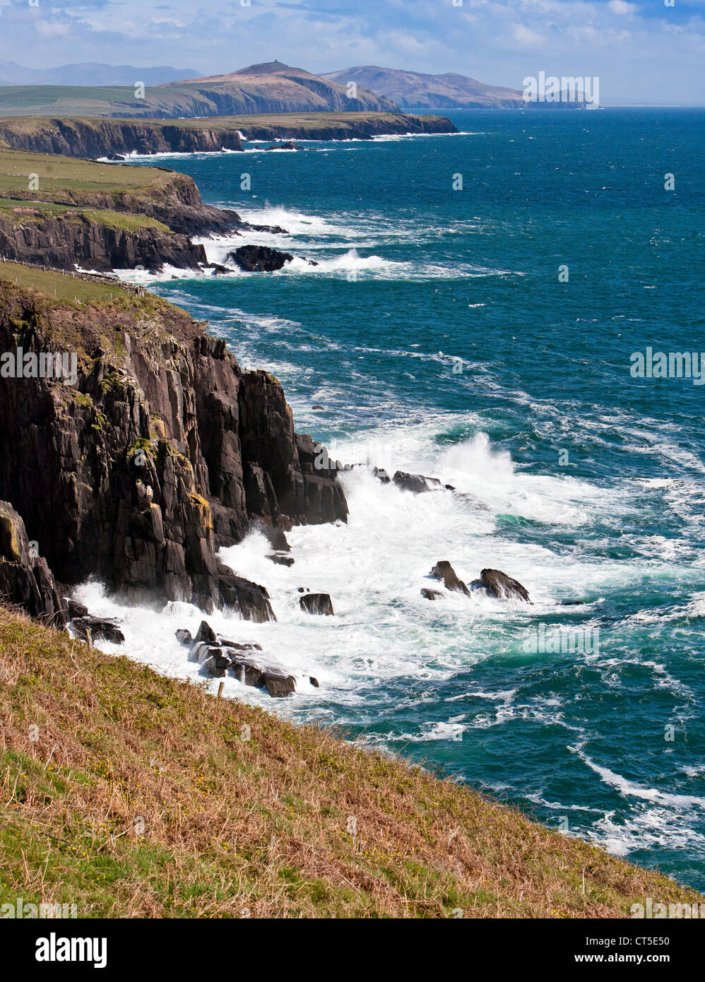 South Dingle coastal cliffs under bright summer sunshine Stock Photo ...