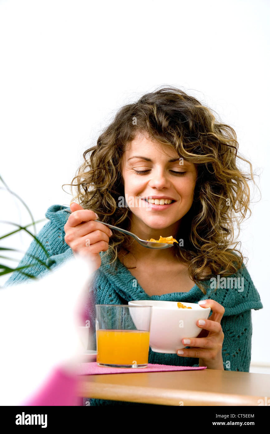 WOMAN EATING BREAKFAST Stock Photo - Alamy
