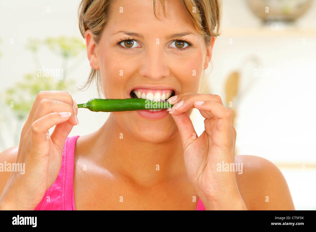 WOMAN EATING SPICE Stock Photo - Alamy