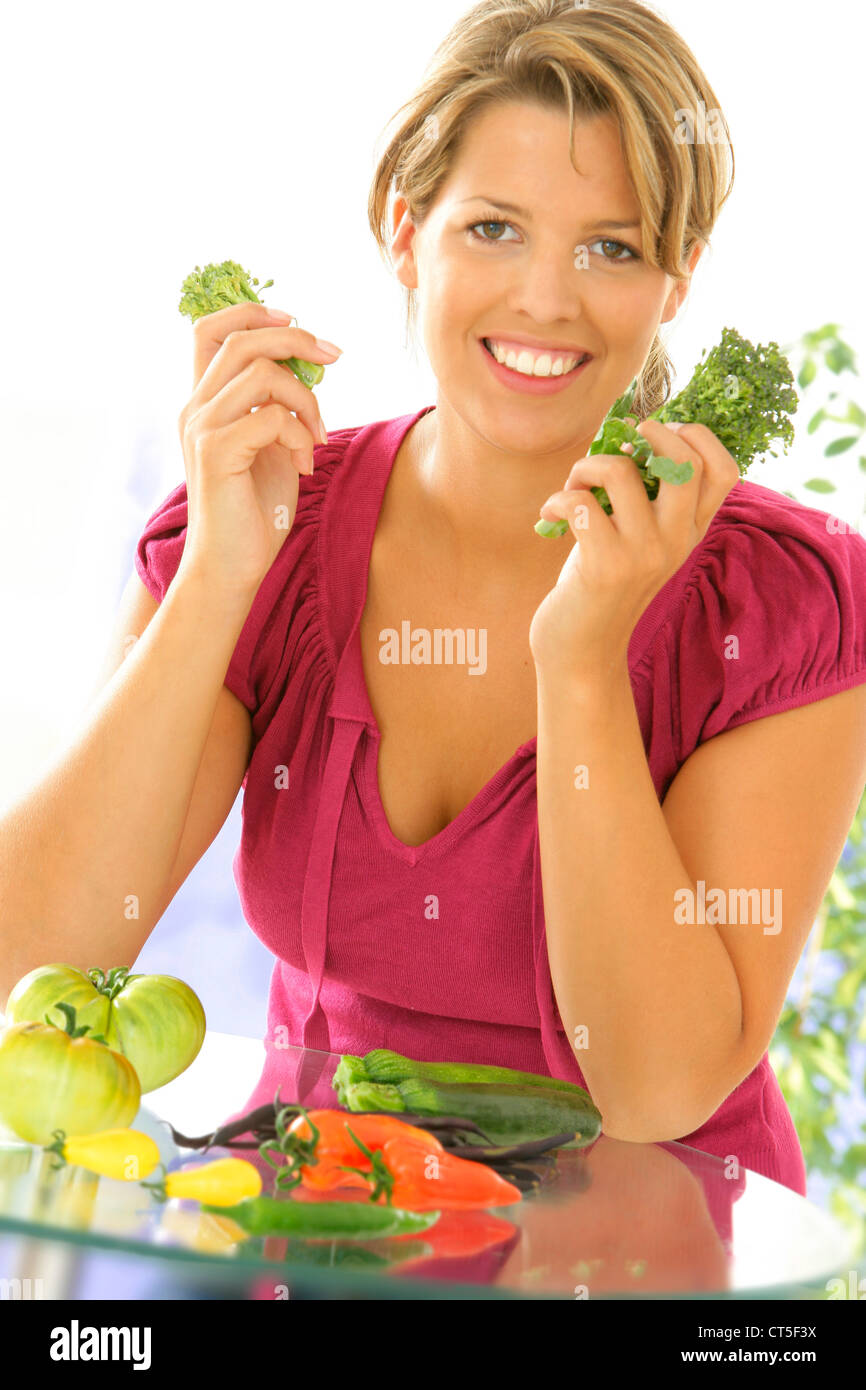 WOMAN EATING VEGETABLE Stock Photo - Alamy