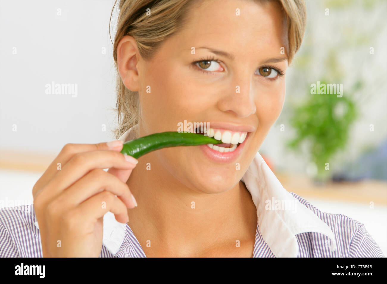 WOMAN EATING SPICE Stock Photo - Alamy