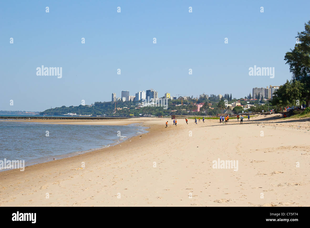 People playing soccer on the beach in Maputo, Mozambique Stock Photo ...
