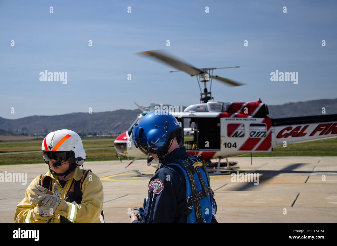 Photo of two members of a Fire Department Helicopter Rescue Team suited ...