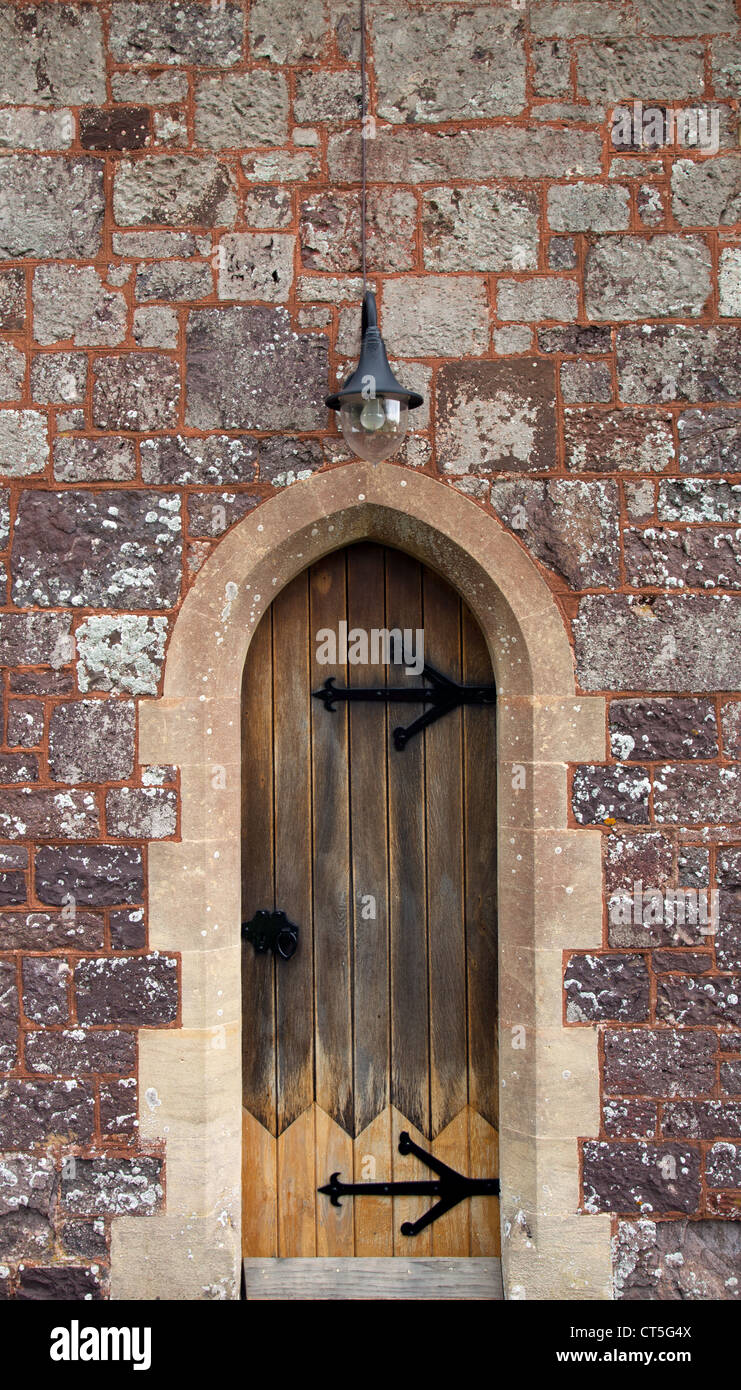 Small doorway in church wall Stock Photo - Alamy