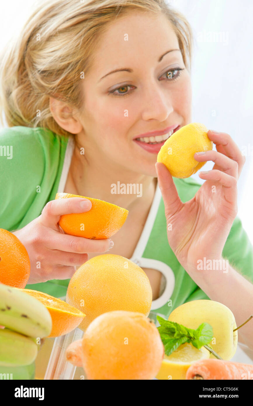 WOMAN EATING FRUIT Stock Photo - Alamy