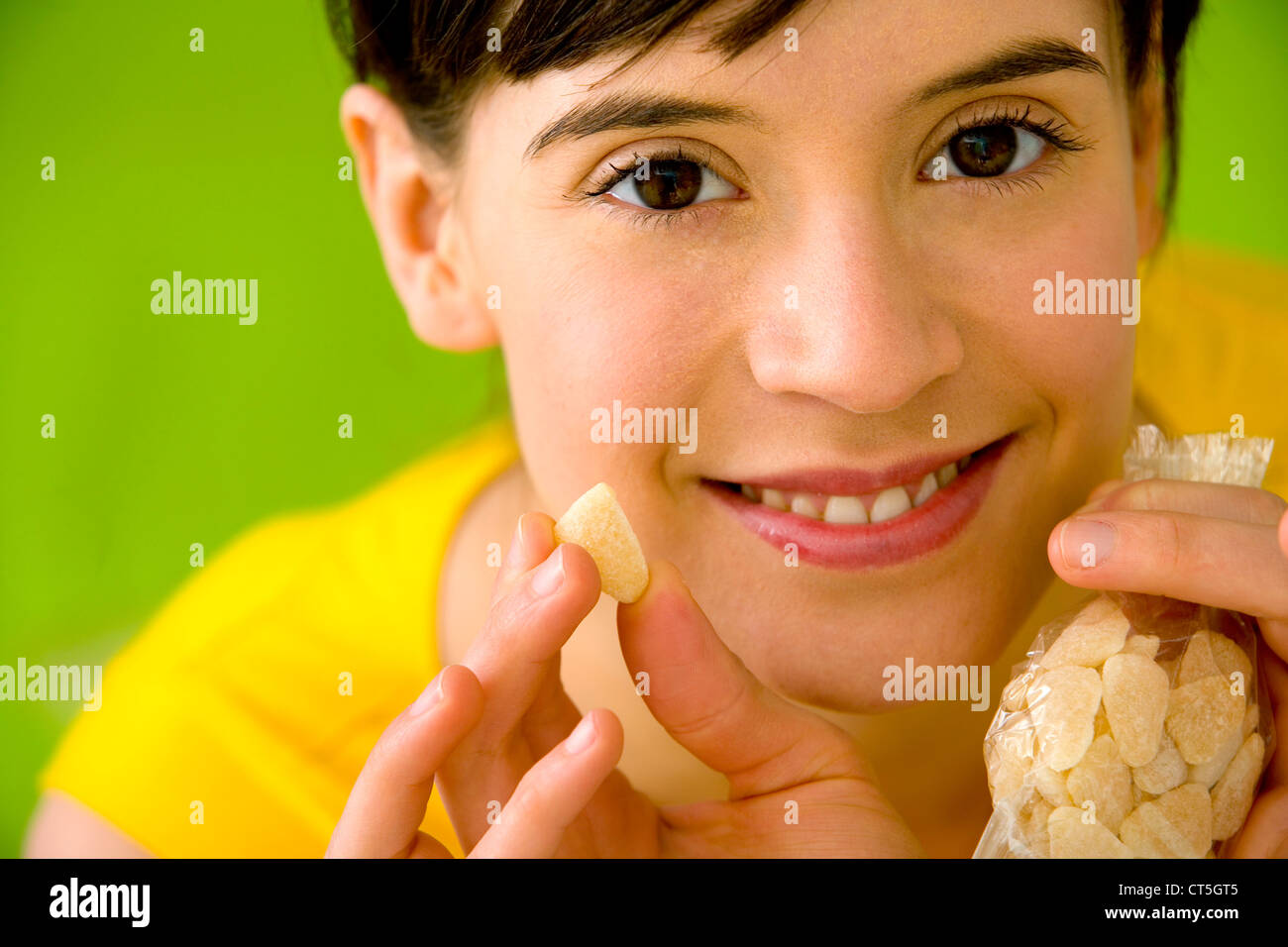 WOMAN EATING SWEETS Stock Photo - Alamy