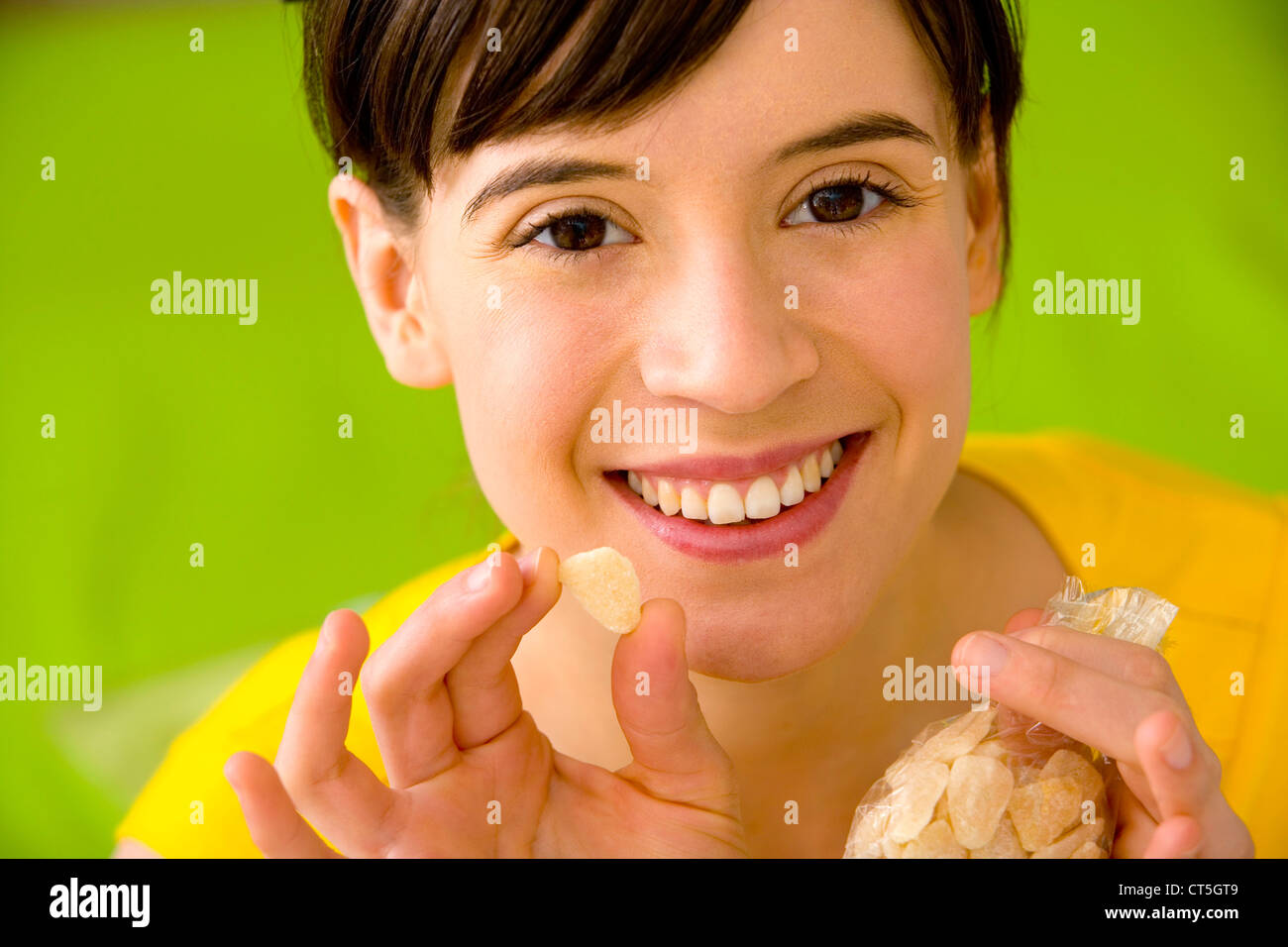 WOMAN EATING SWEETS Stock Photo - Alamy