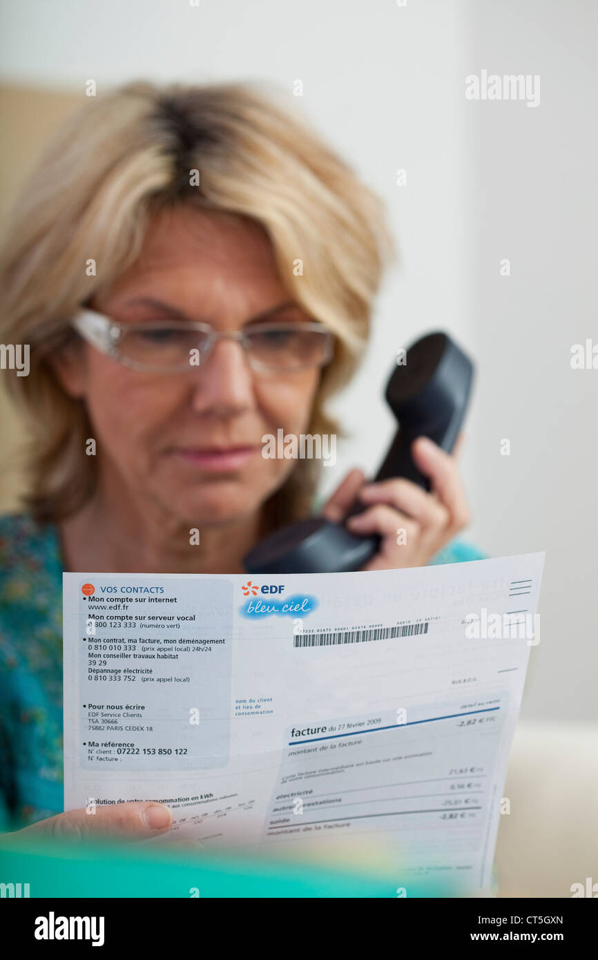 Mature woman reading forms papers hi-res stock photography and images ...