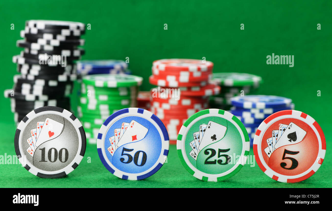 Gaming chips on the green cloth. High detailed photo Stock Photo - Alamy