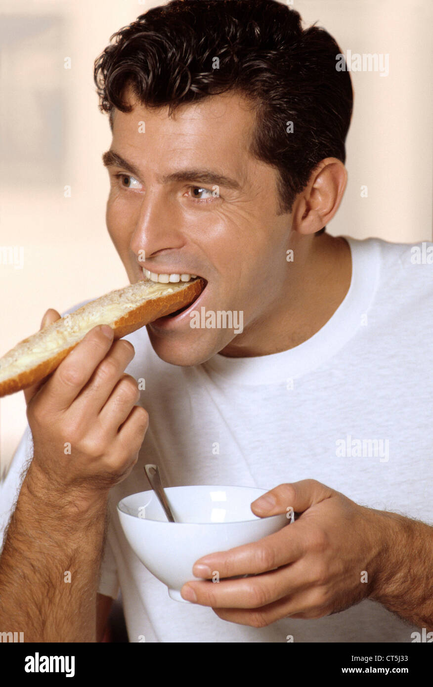 MAN EATING BREAKFAST Stock Photo - Alamy