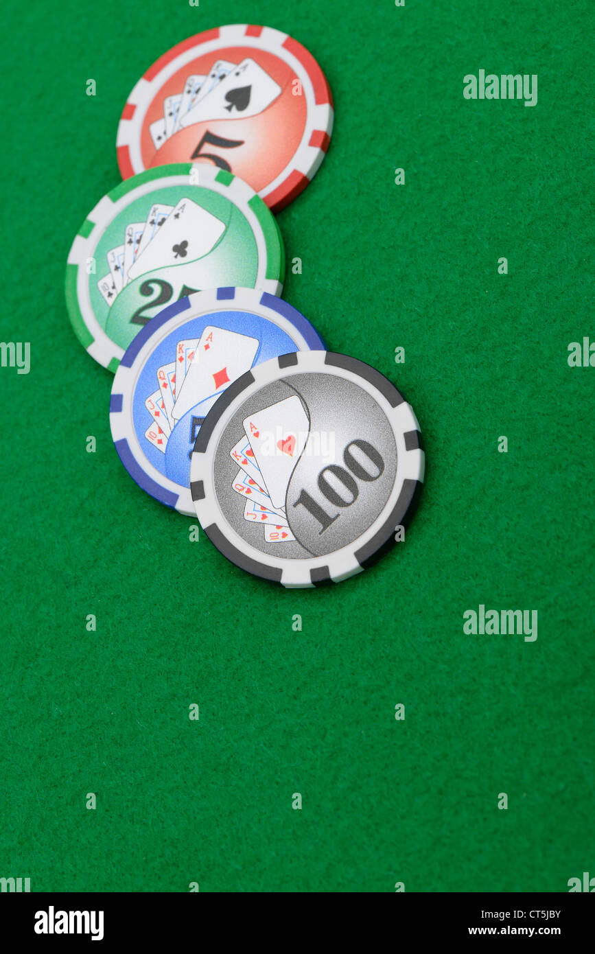 Gaming chips on the green cloth. High detailed photo Stock Photo - Alamy