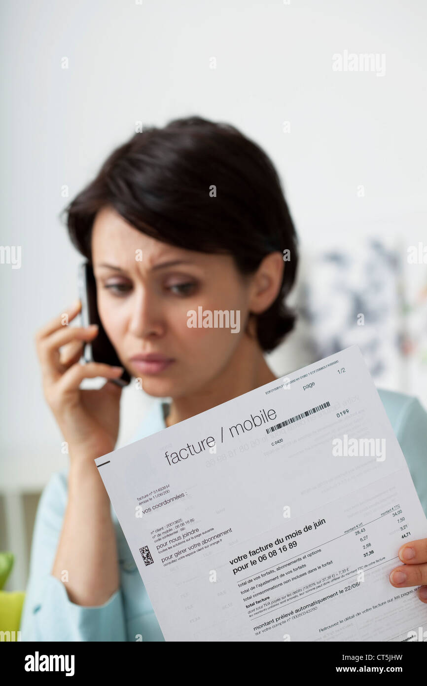 WOMAN DOING PAPERWORK Stock Photo - Alamy