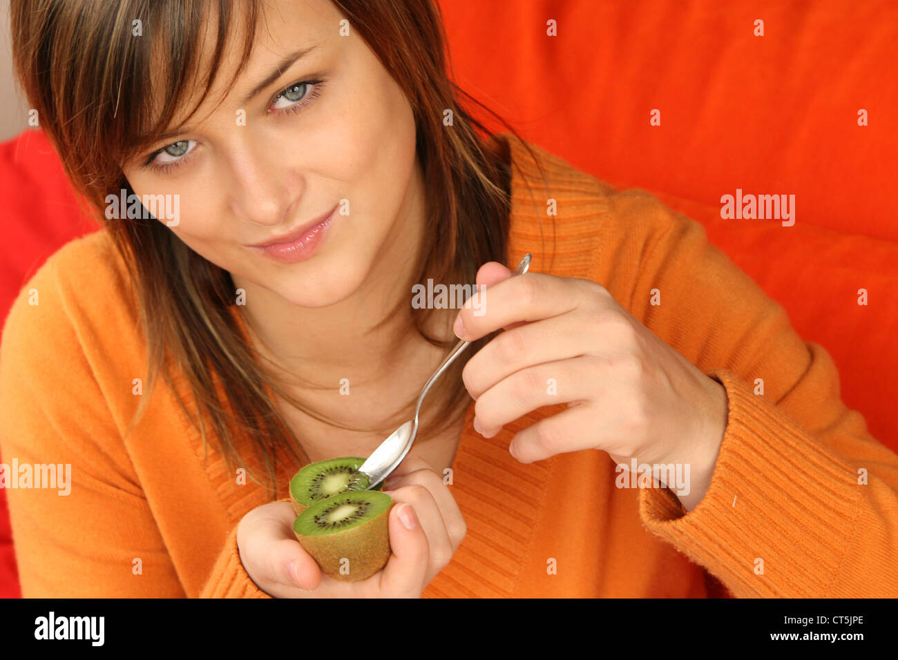 WOMAN EATING FRUIT Stock Photo - Alamy