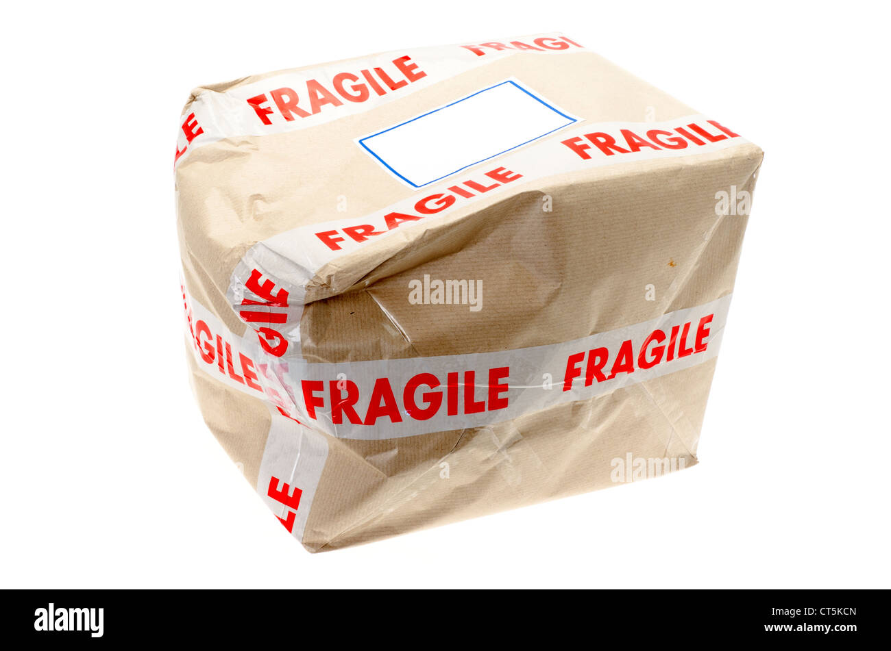 Damaged cardboard box that was covered with fragile tape - studio shot with a white background ...