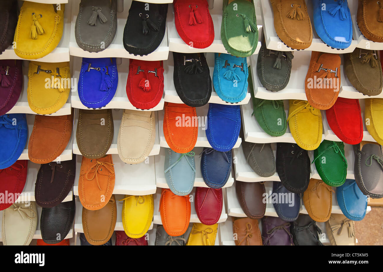 variety of the colorful leather shoes in the shop Stock Photo - Alamy