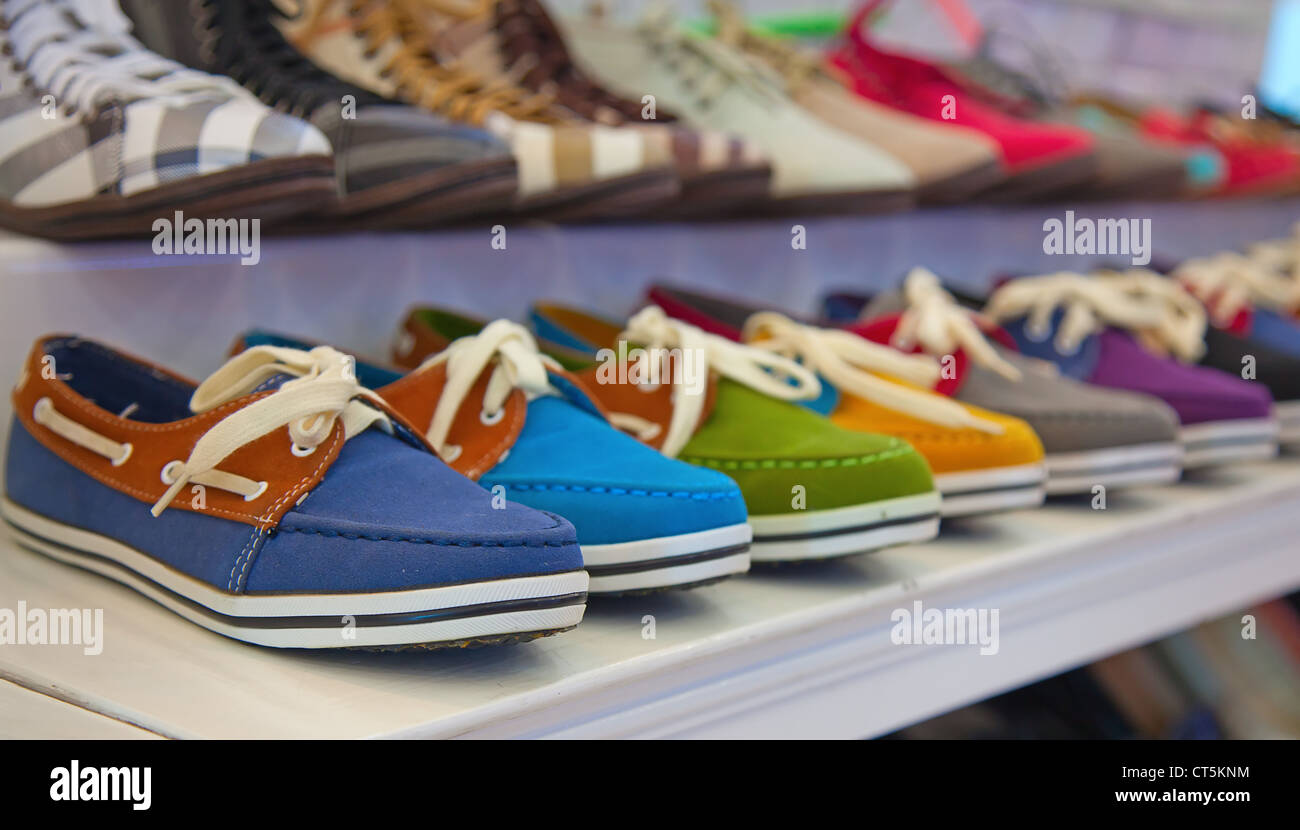 variety of the colorful leather shoes in the shop Stock Photo - Alamy